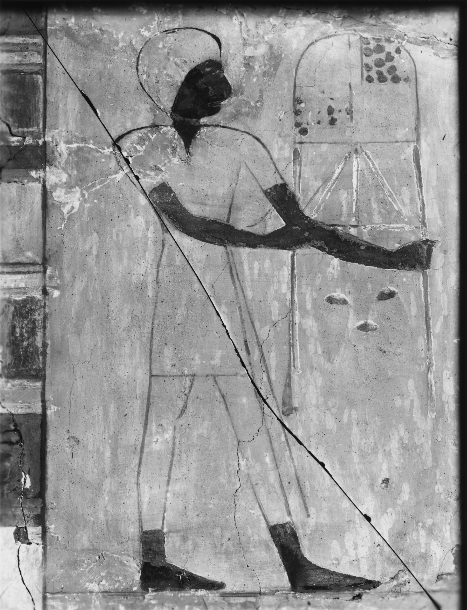 Wall Fragment with Man Carrying an Offering Table | The Walters Art Museum